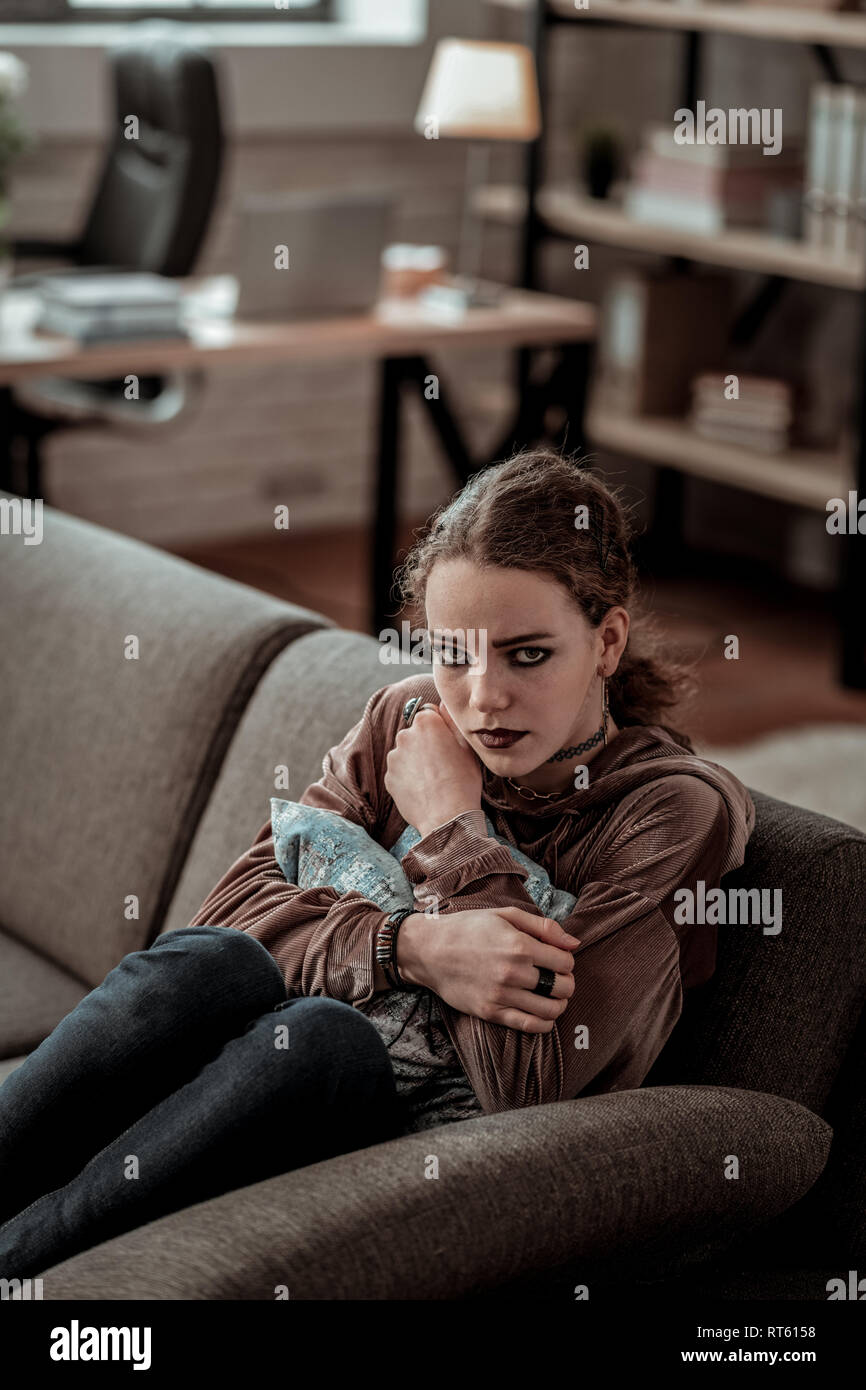 Problems at home. Teenage girl with dark makeup feeling extremely ...