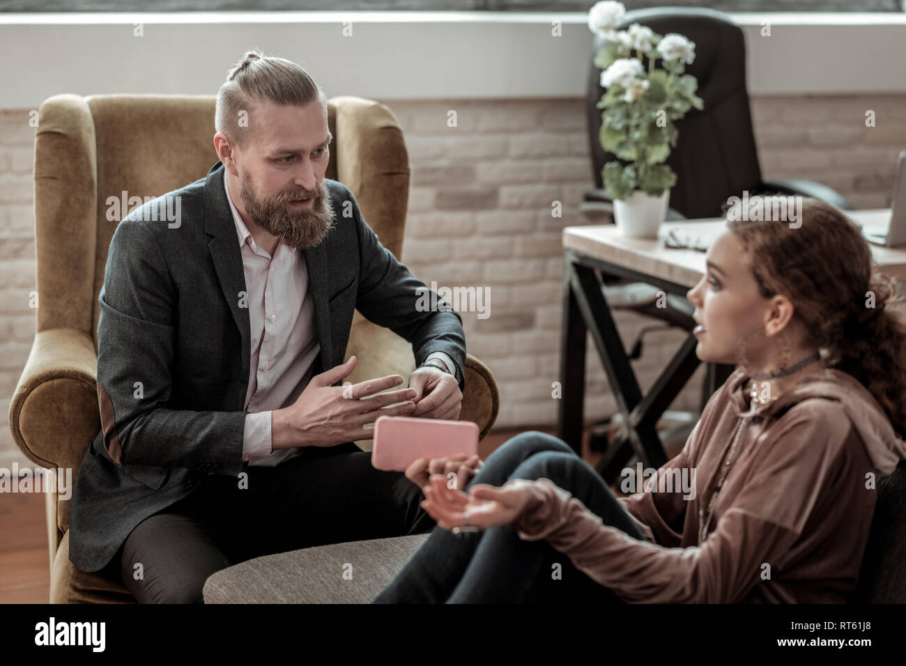 Lonely teenager. Dark-haired stressed teenage girl feeling lost and ...