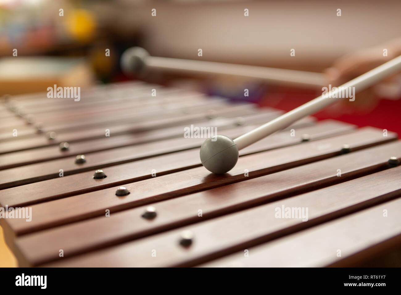 Schoolboy playing xylophone in a classroom Stock Photo - Alamy