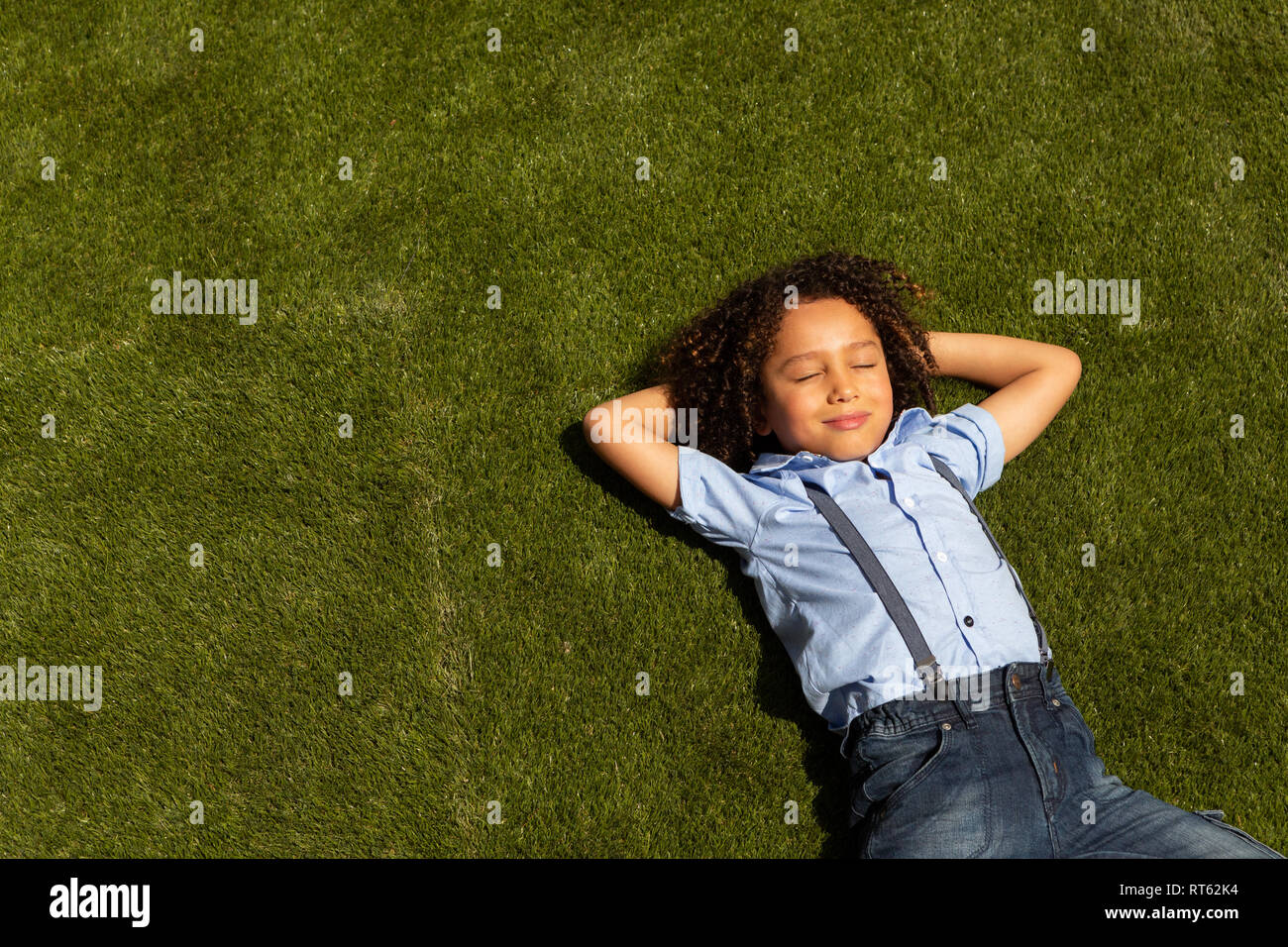 Schoolgirl relaxing in the school playground Stock Photo - Alamy