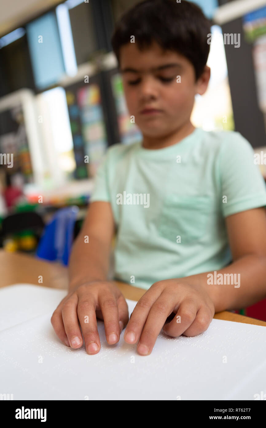 Blind schoolboy reading braille hi-res stock photography and images - Alamy