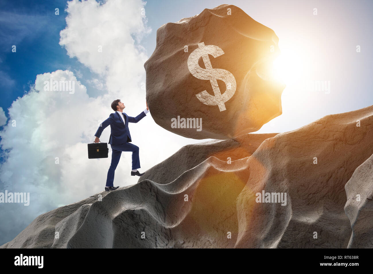 Man rolling rock up hill hi-res stock photography and images - Alamy