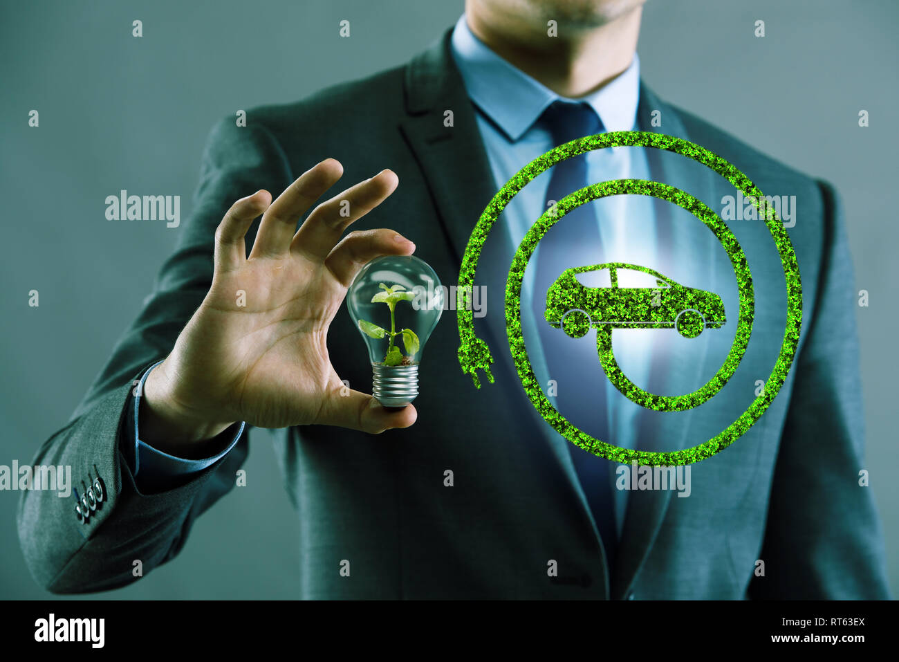 Electric vehicle concept with lightbulb Stock Photo - Alamy