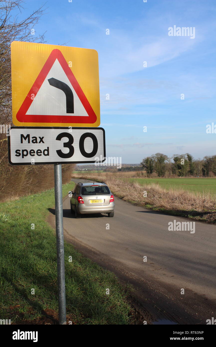 Road sign 30 miles an hour sign Waring of bad bend in country road ...