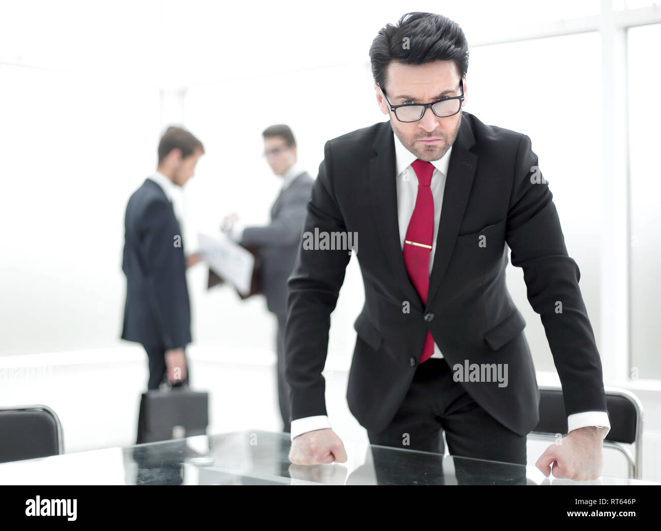 strict businessman standing in the conference room Stock Photo - Alamy