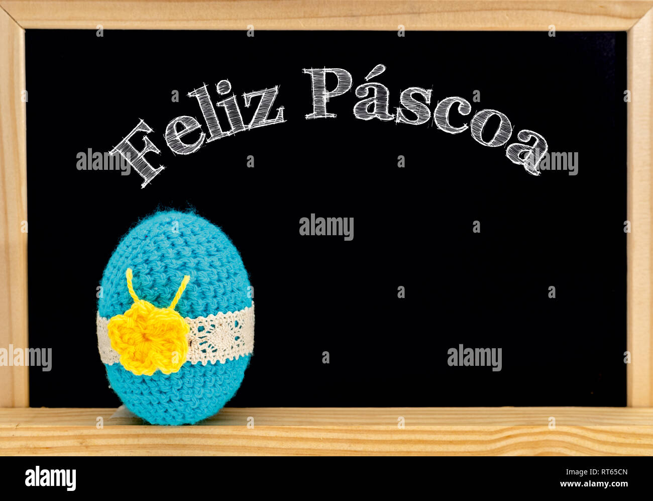 Easter frame with painted eggs and chalkboard. Happy Easter in white ...