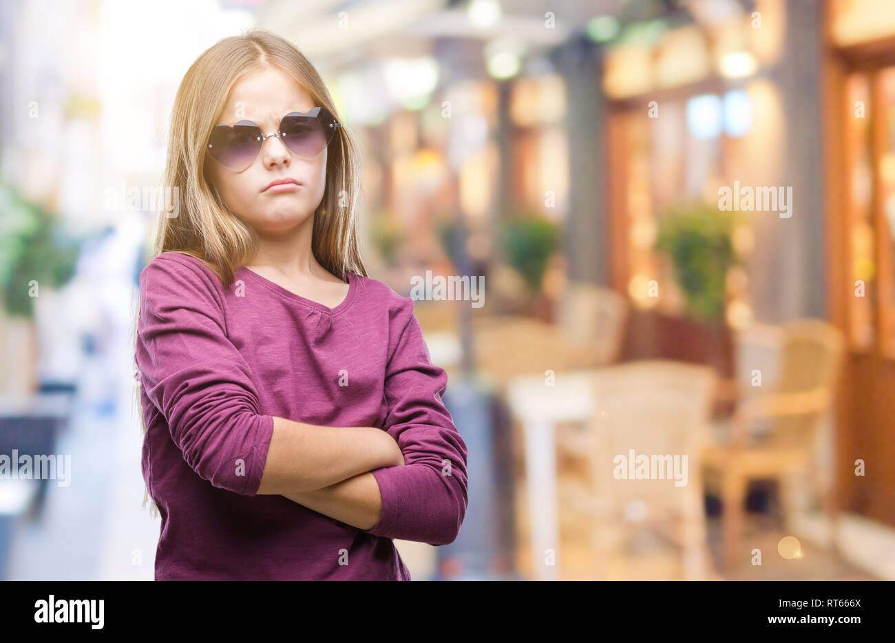Young beautiful girl wearing sunglasses over isolated background ...