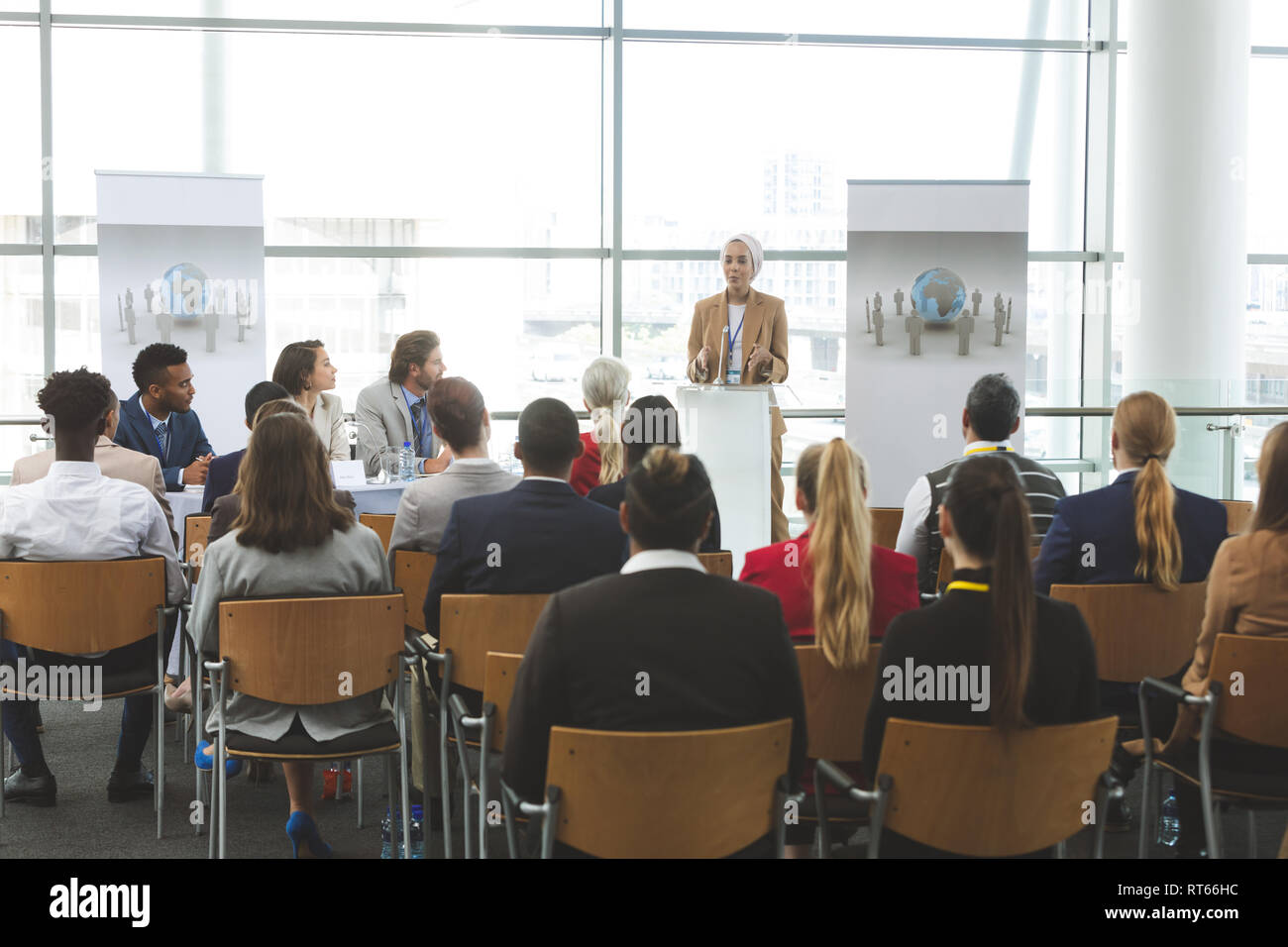 Female speaker speaks in a business seminar Stock Photo - Alamy
