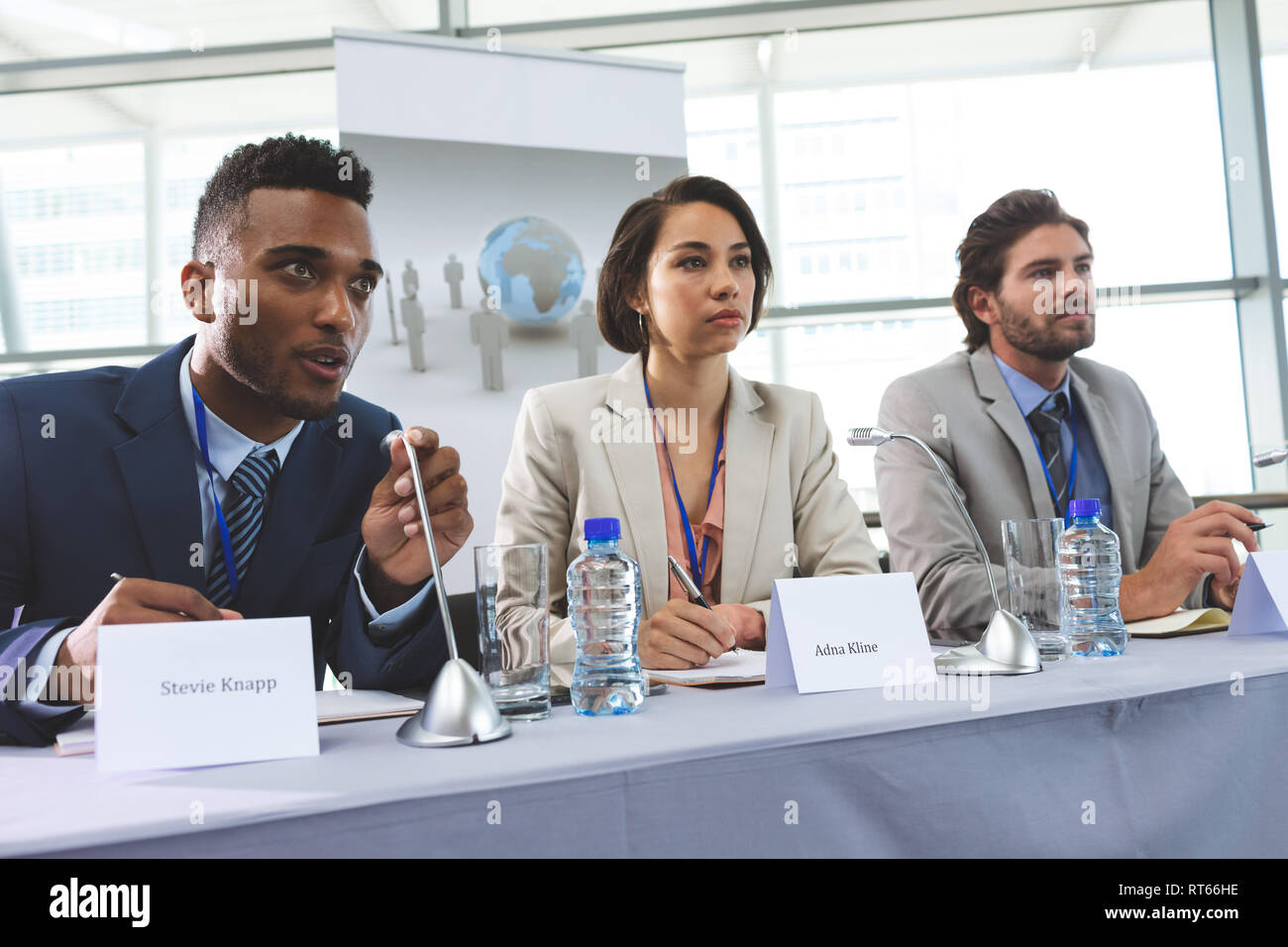 Diverse business people sitting table hi-res stock photography and ...