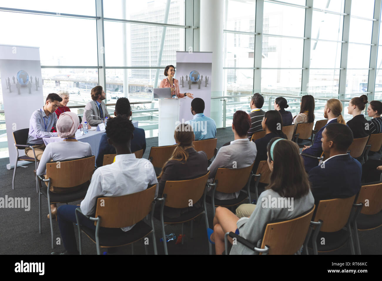 Group of business people attending a seminar Stock Photo - Alamy