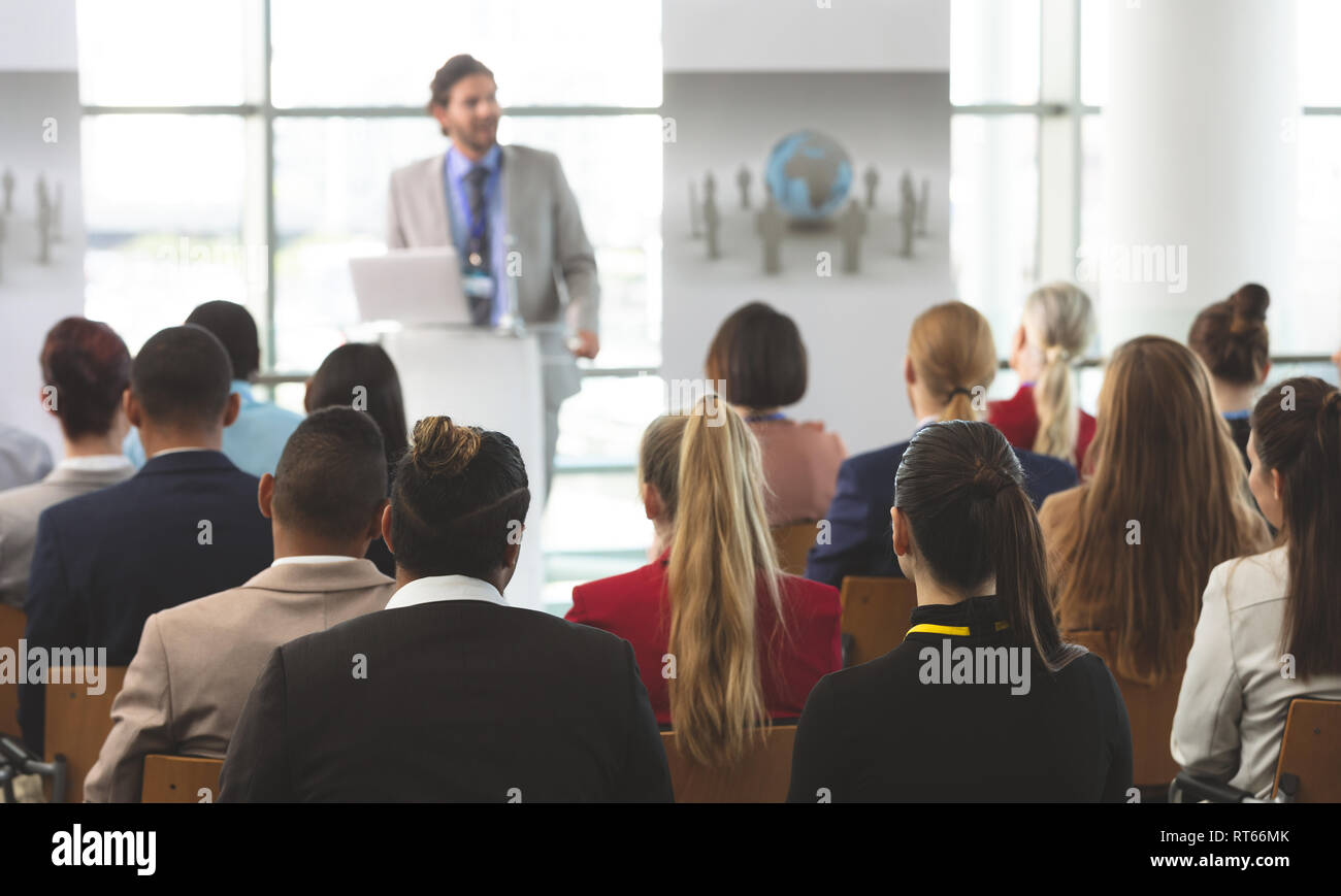 Group of business people attending a seminar Stock Photo - Alamy