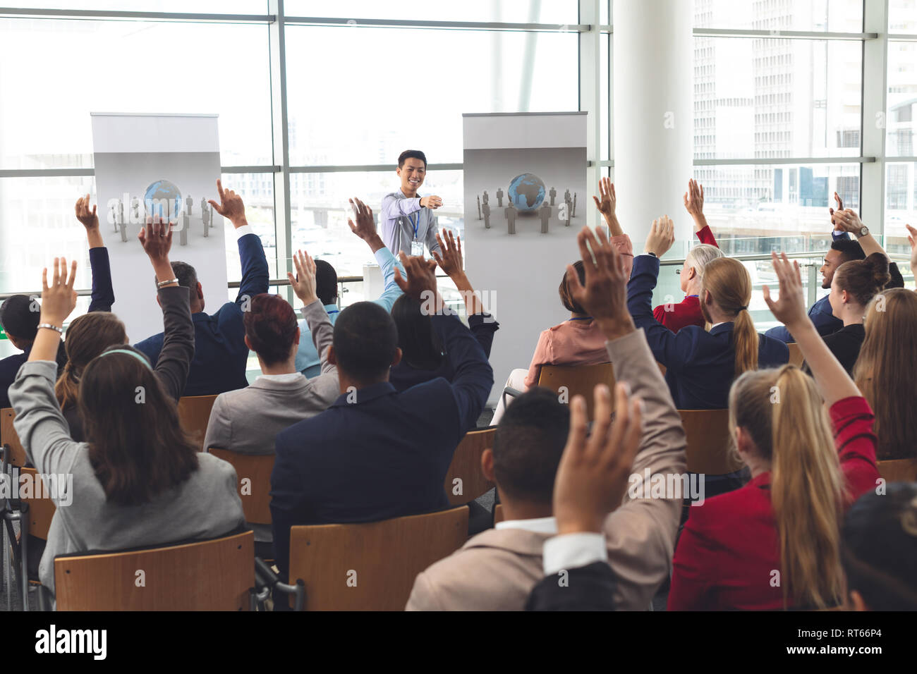 Meeting speaker hands raised hi-res stock photography and images - Alamy