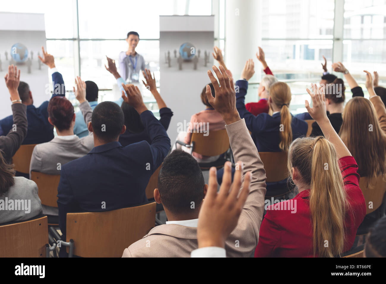 Diverse raised hands hi-res stock photography and images - Alamy
