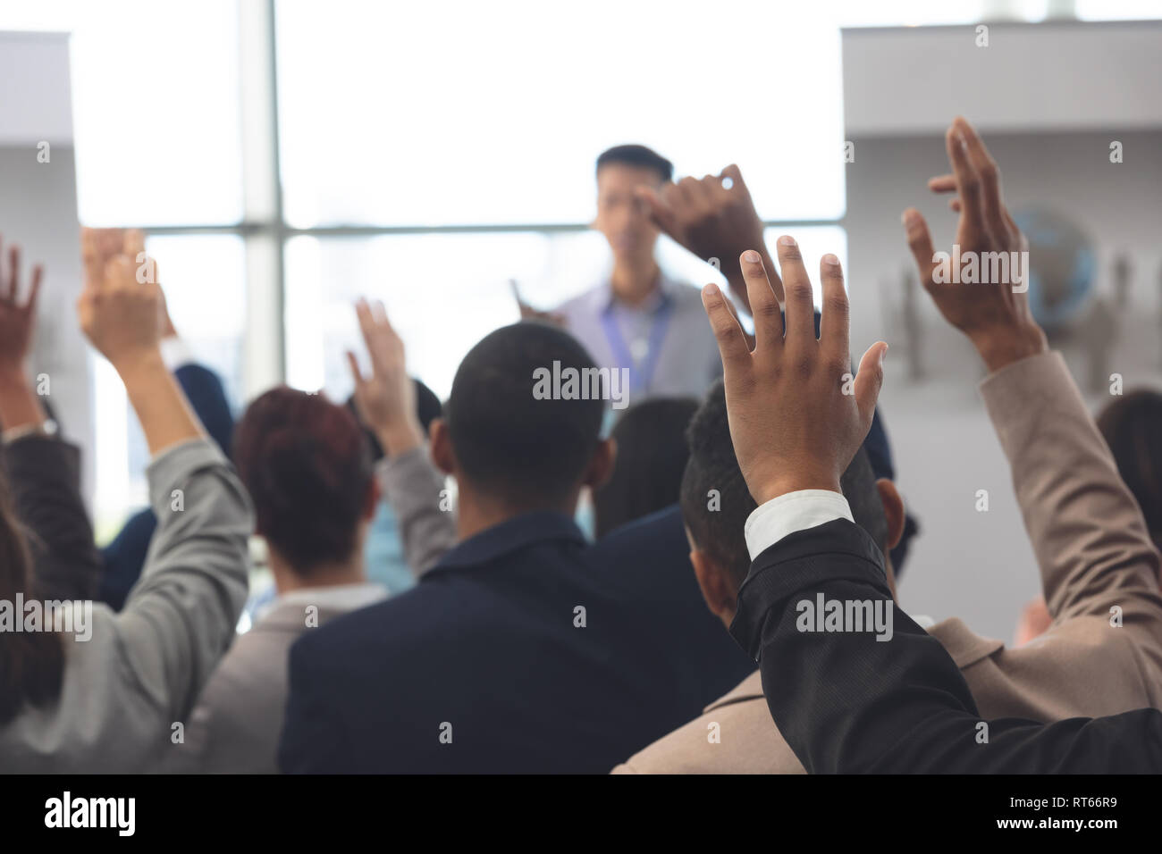 Meeting speaker hands raised hi-res stock photography and images - Alamy