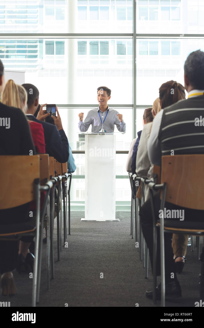Asian businessman speaks at a business seminar Stock Photo - Alamy