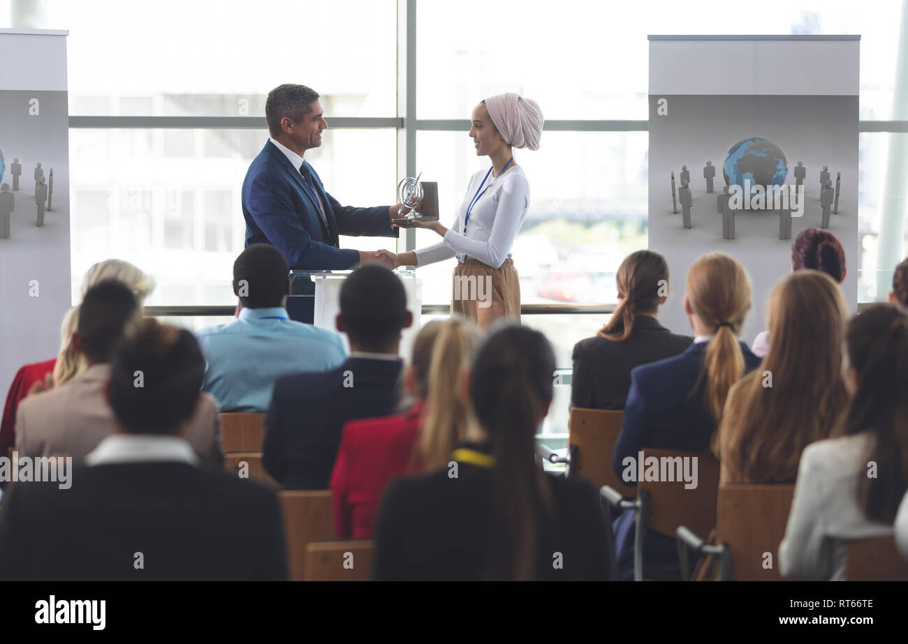 Businessman receiving award from smiling hi-res stock photography and ...