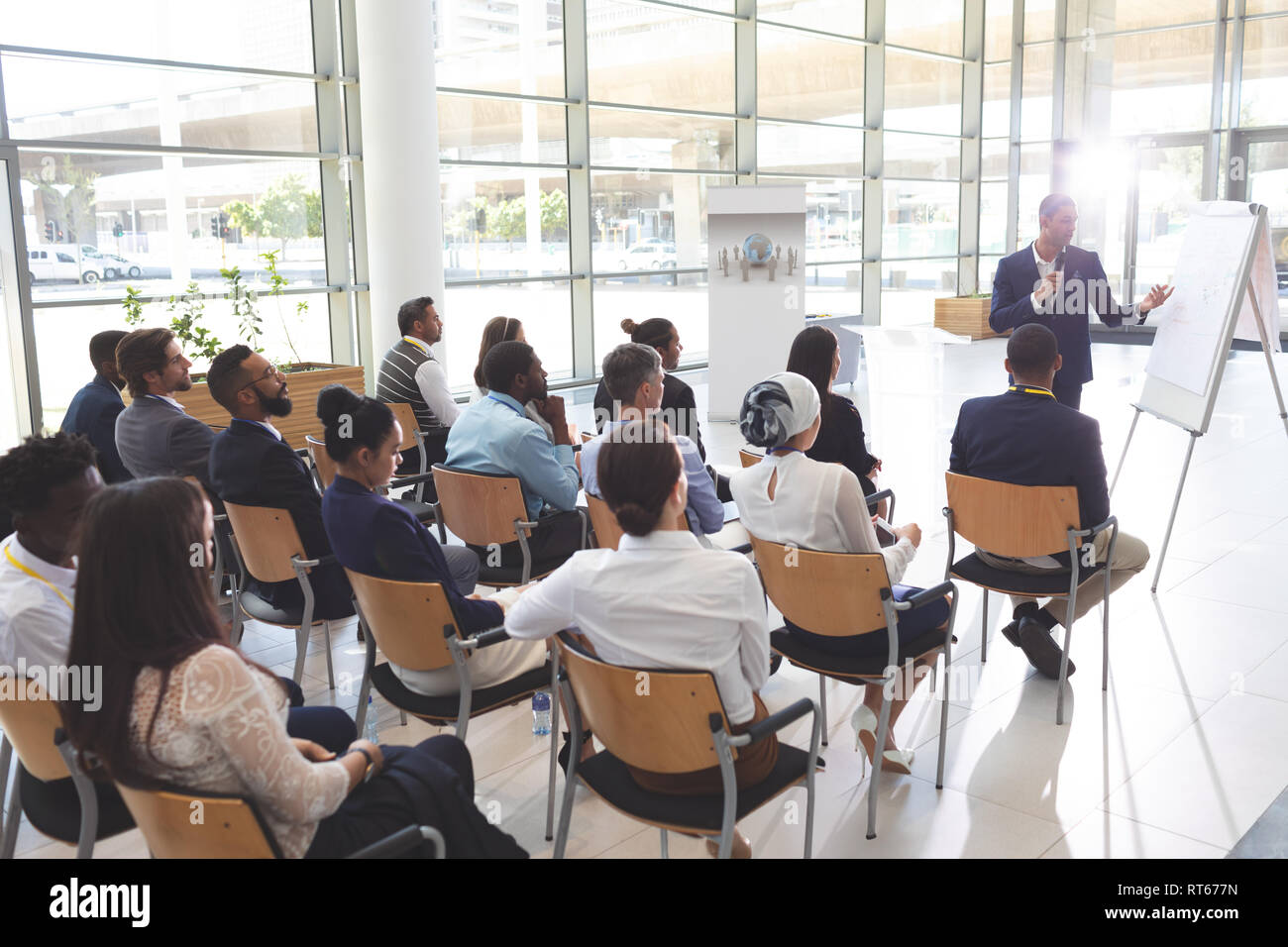 Male speaker speaking in a business seminar Stock Photo - Alamy