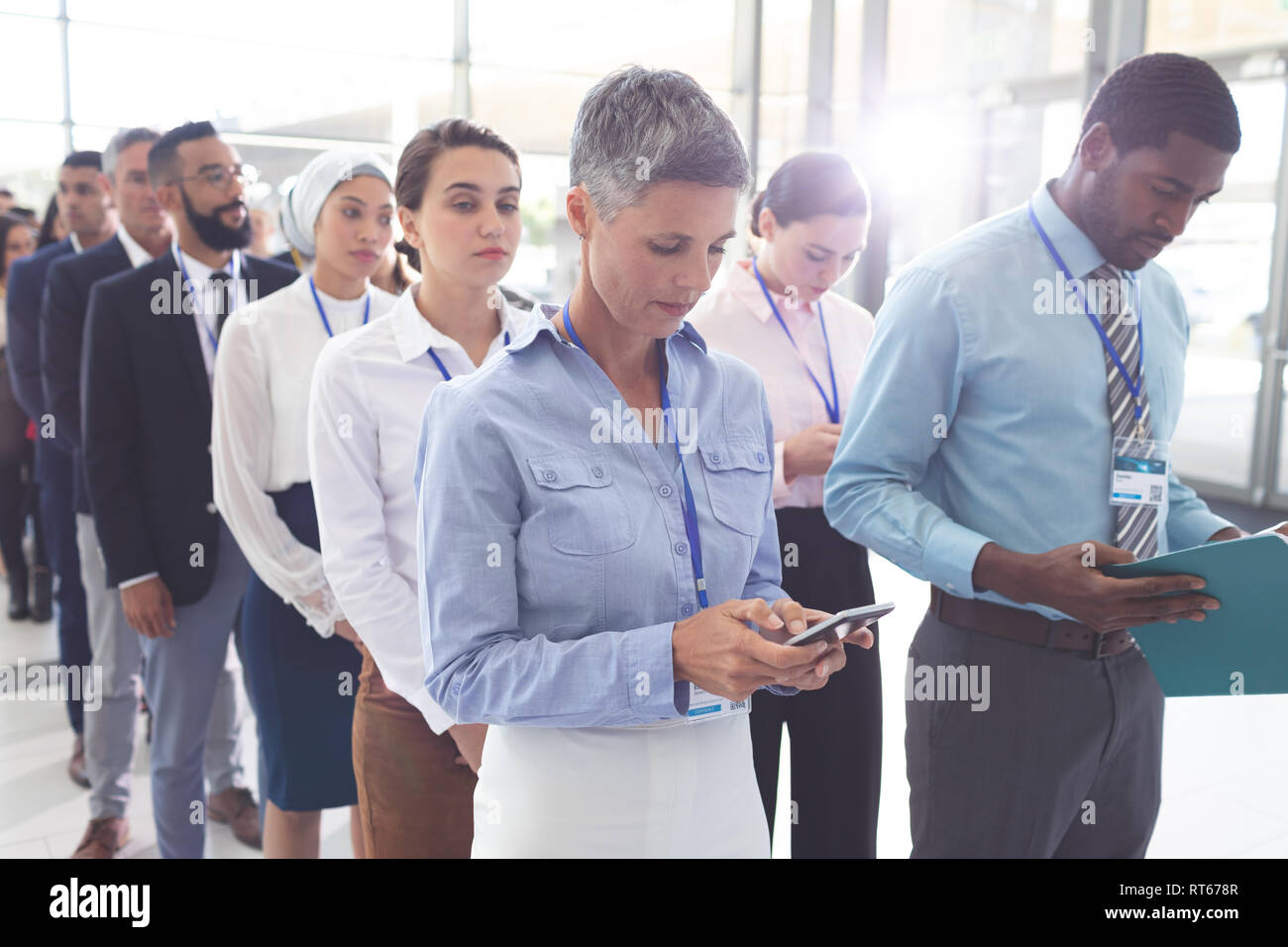 Queue mobile phone hi-res stock photography and images - Alamy