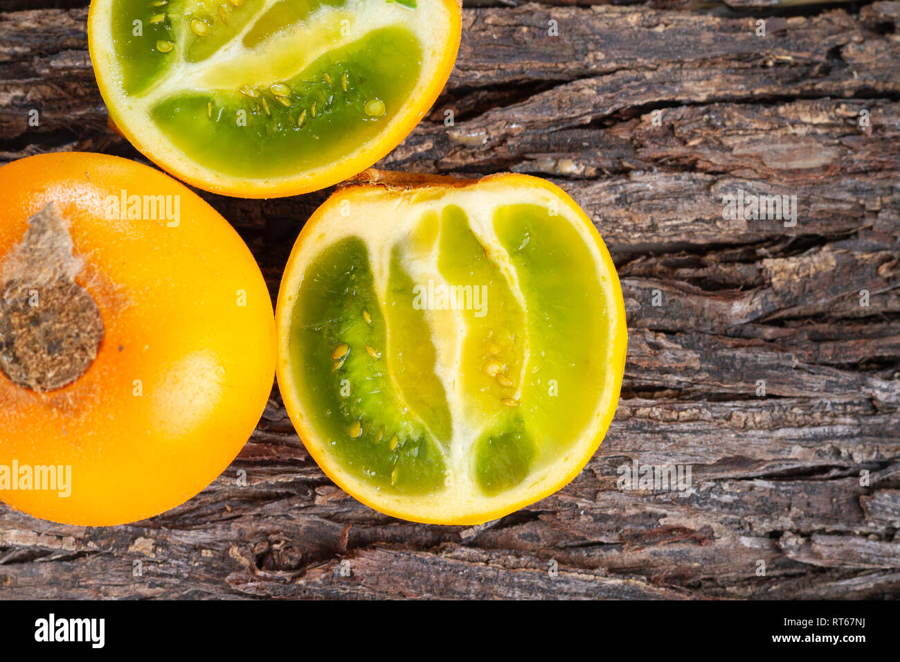 Fruit of lulo on tree bark (Solanum quitoense Stock Photo - Alamy