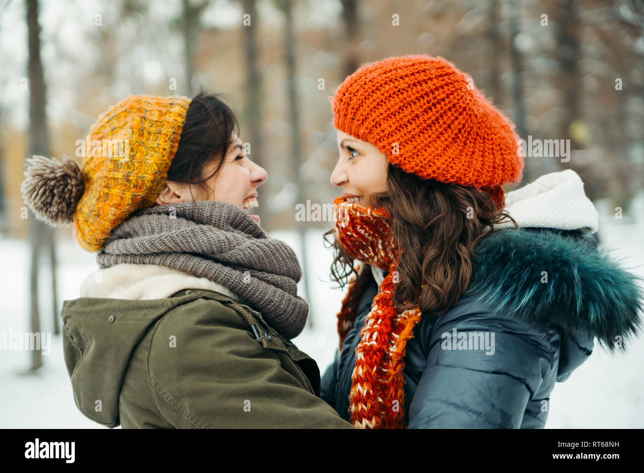 Two best friends face to face in the snow Stock Photo - Alamy
