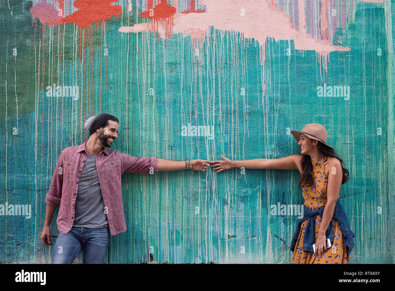 Two People Reaching For Each Other