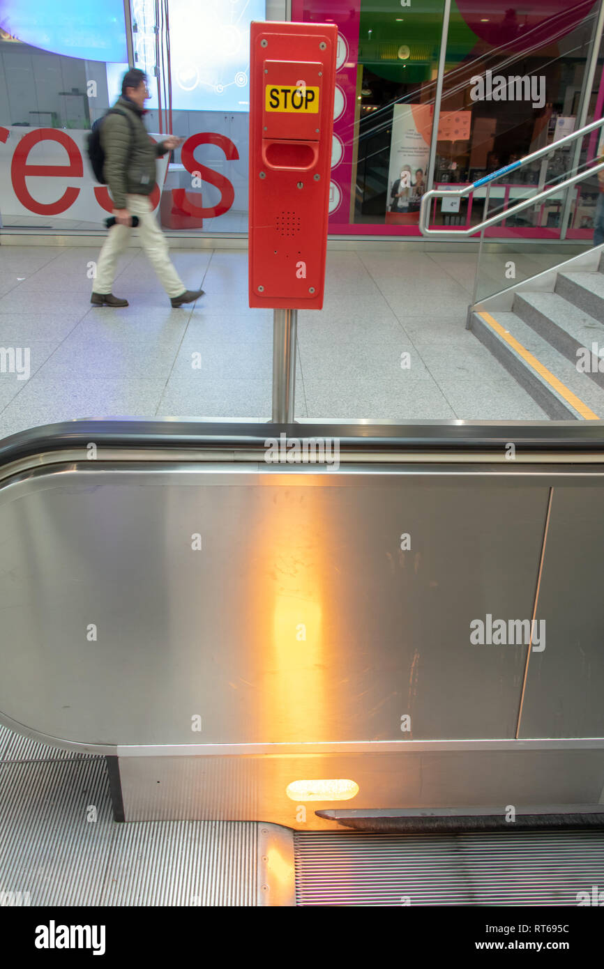 Red handle switch for emergency stops on an escalator Stock Photo - Alamy