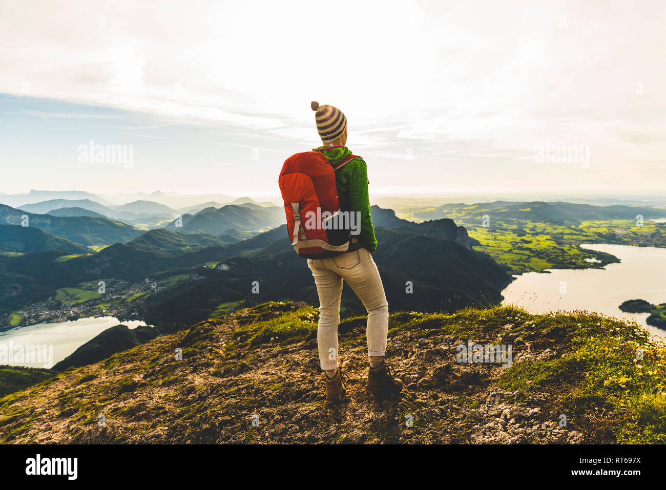 Austria, Salzkammergut, Hiker with backpack hiking in the Alps Stock ...