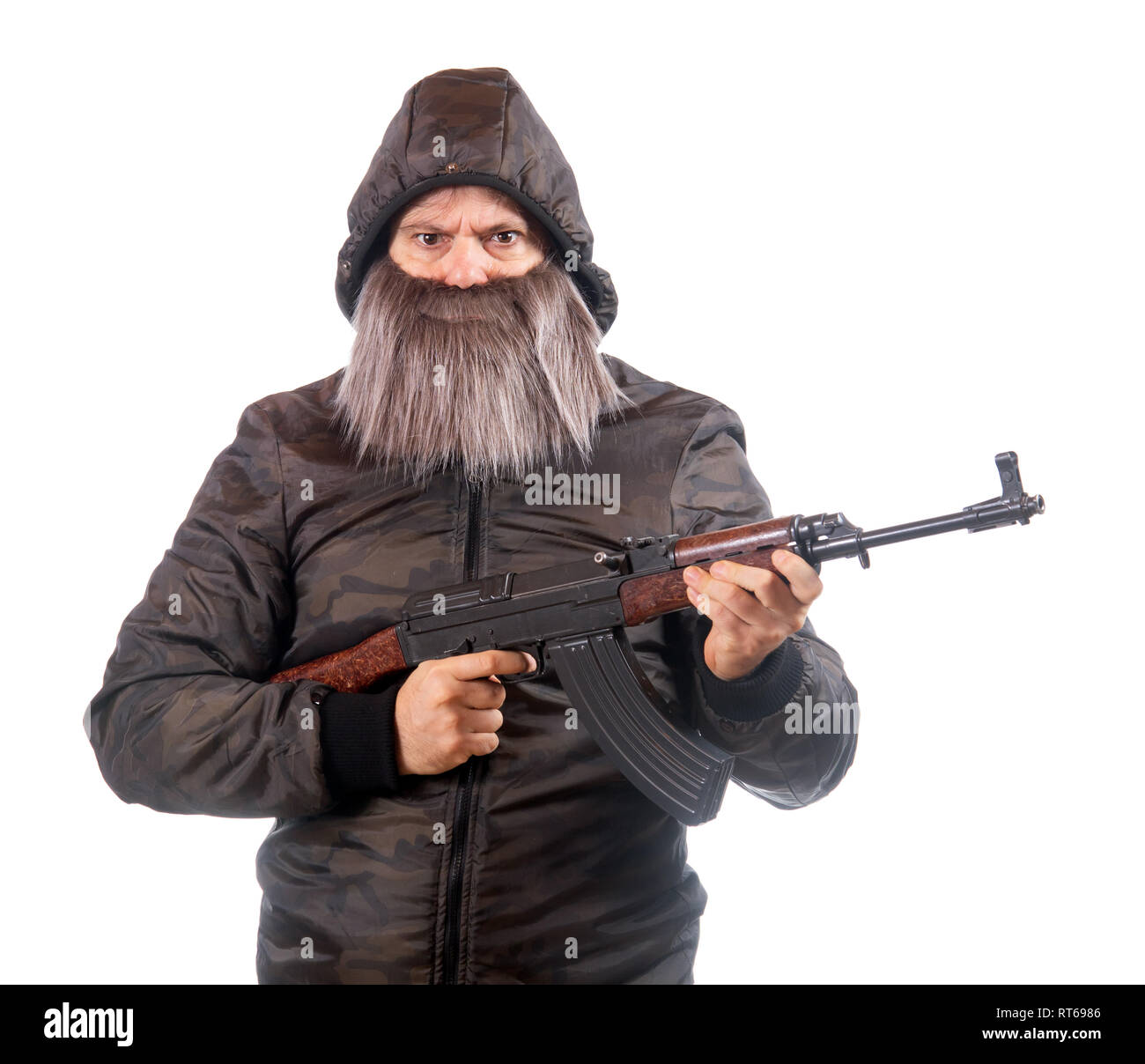 The bearded man armed with kalashnikov isolated on a white background ...