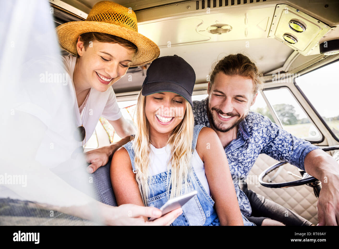 Carefree friends inside van hi-res stock photography and images - Alamy