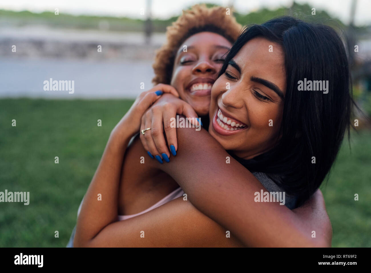 Two friends hugging hi-res stock photography and images - Alamy