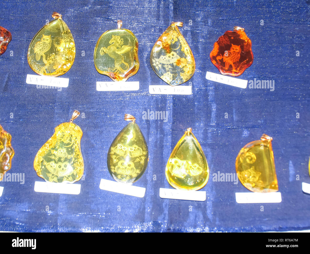 Products and jewelry from amber. Processed amber Stock Photo - Alamy