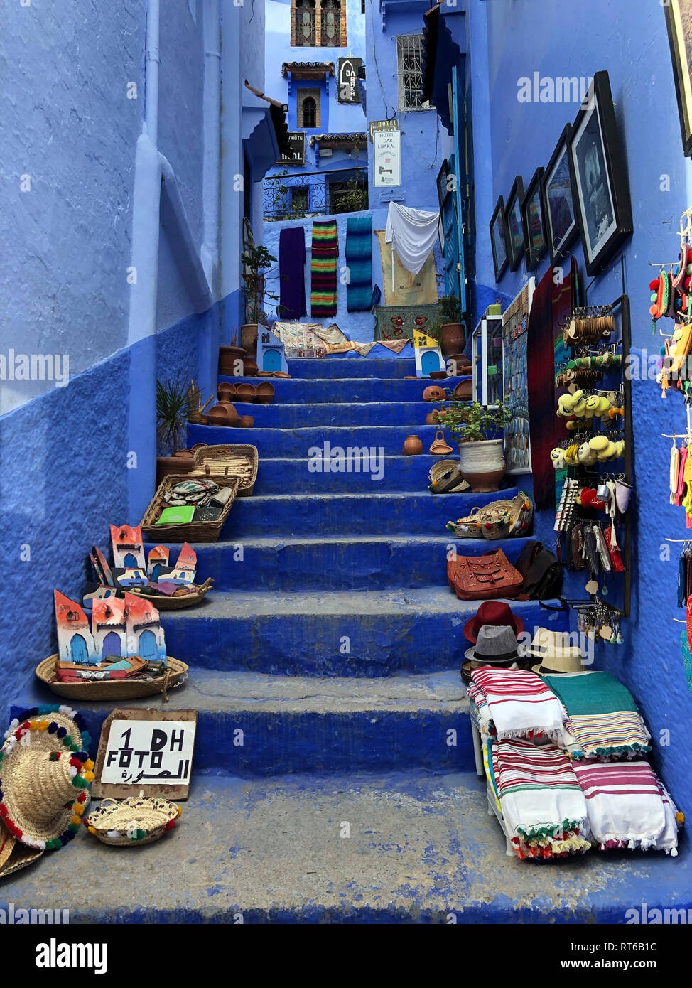 Souvenirs on display on the steps in the medina of Chefchaouen, Morocco ...