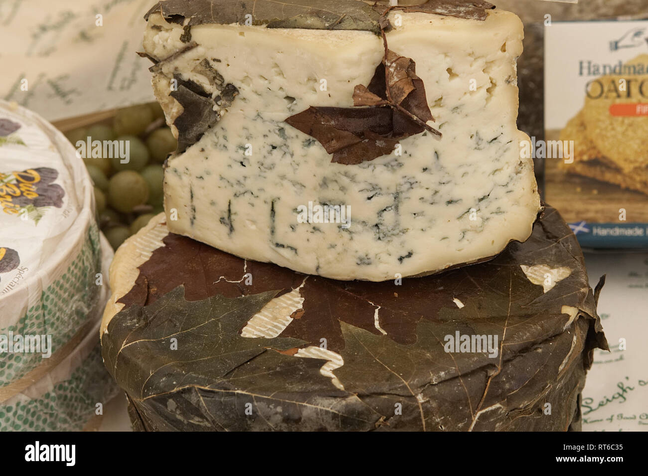 Old picos blue cheese wrapped in Maple leaves Stock Photo - Alamy