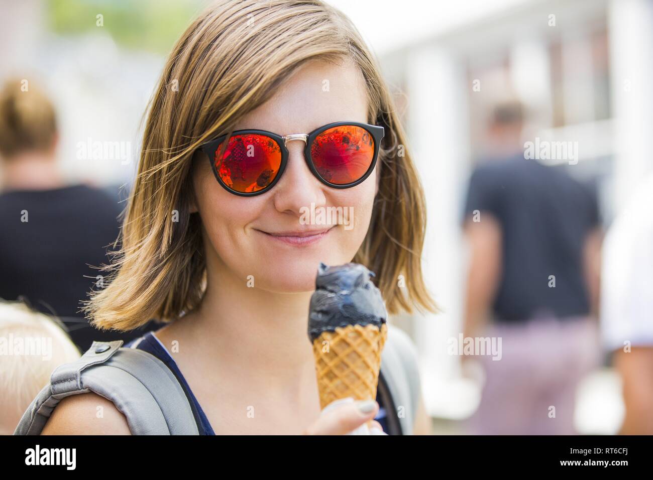 Portrait of woman, eating ice-cream outdoor, Urban and blessing concept ...