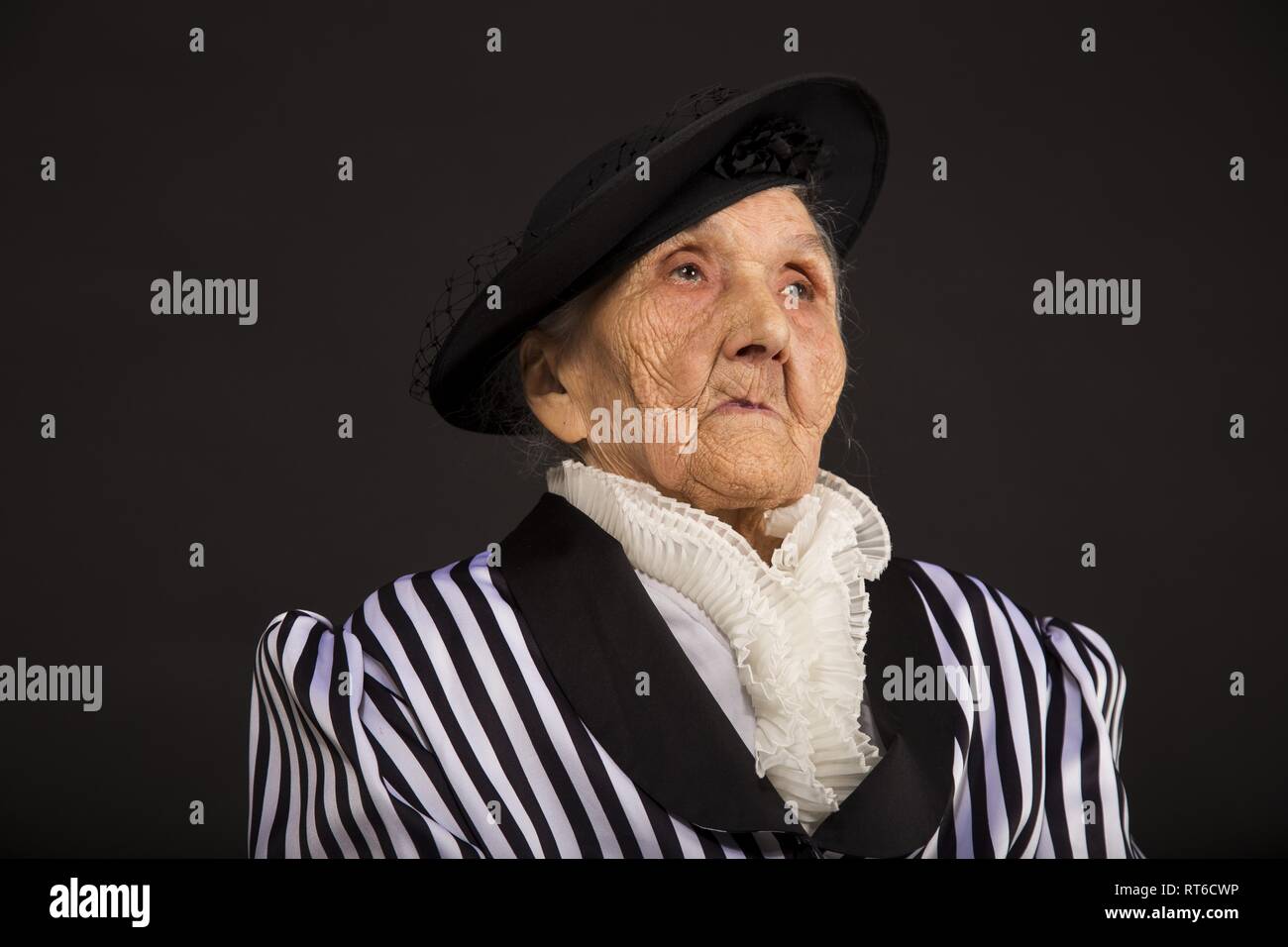 Stylish old woman in black hat Stock Photo - Alamy