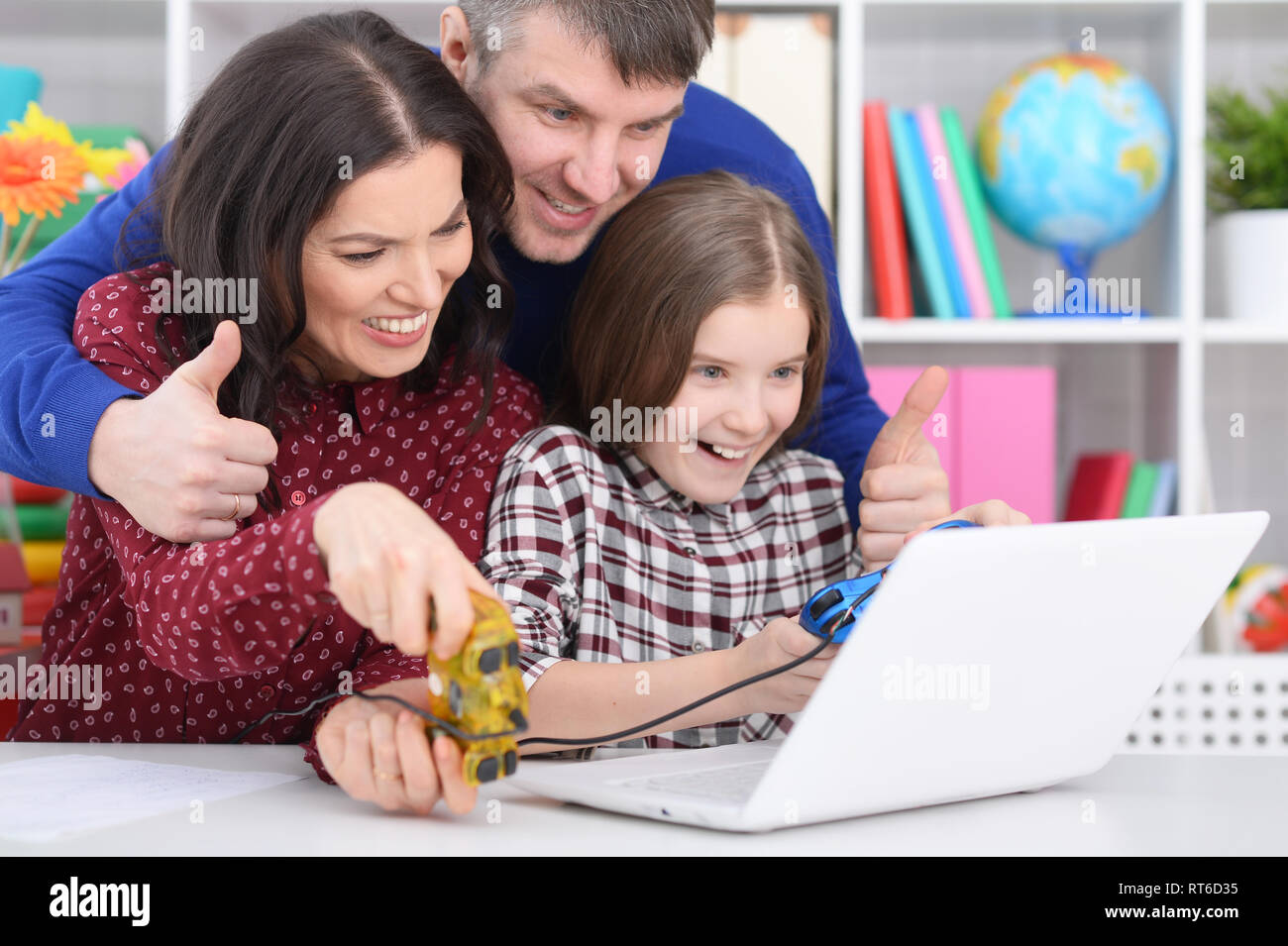Portrait girl playing computer hi-res stock photography and images - Alamy