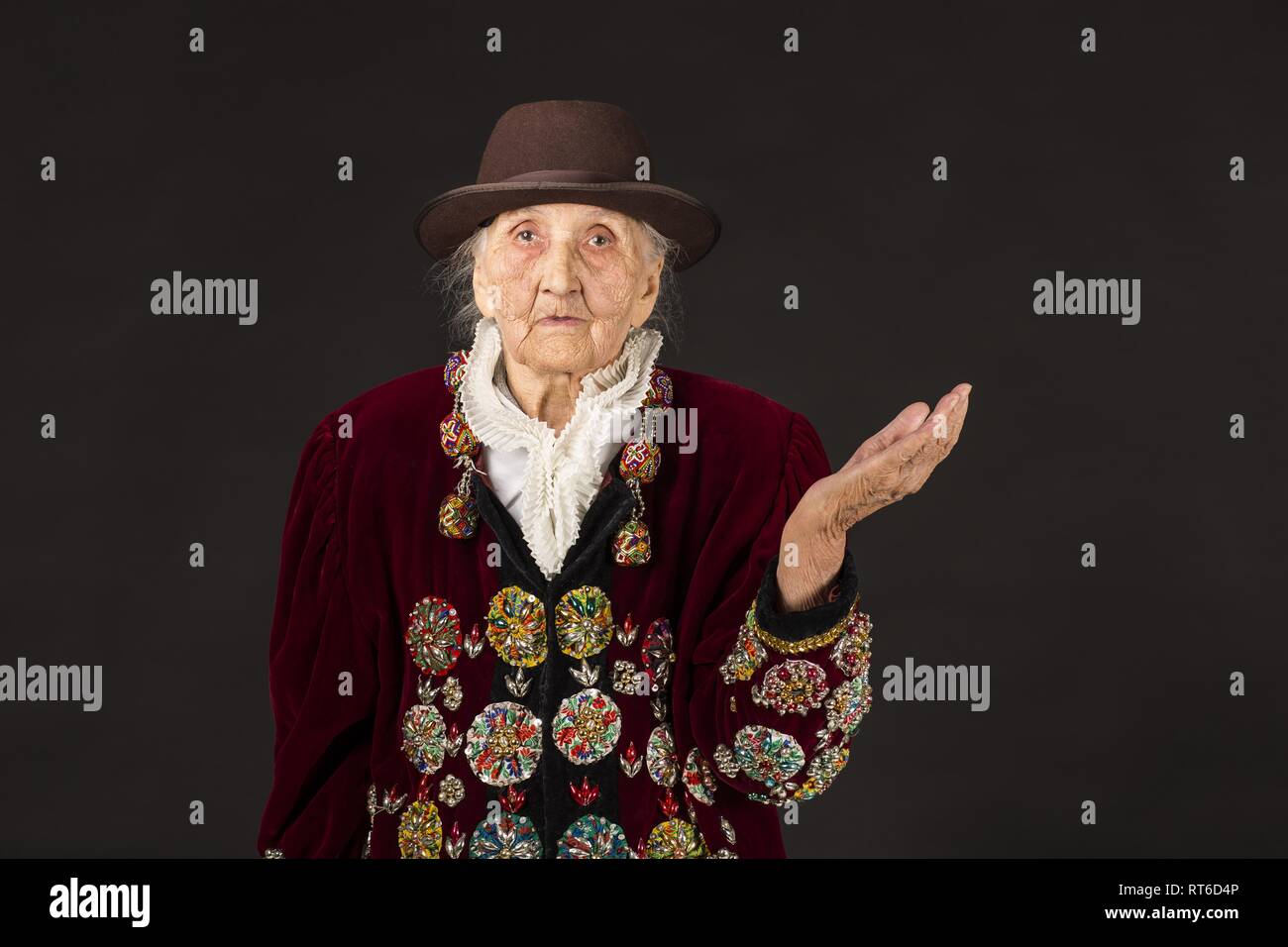 Vintage old woman in ethno needelworked jacket Stock Photo - Alamy