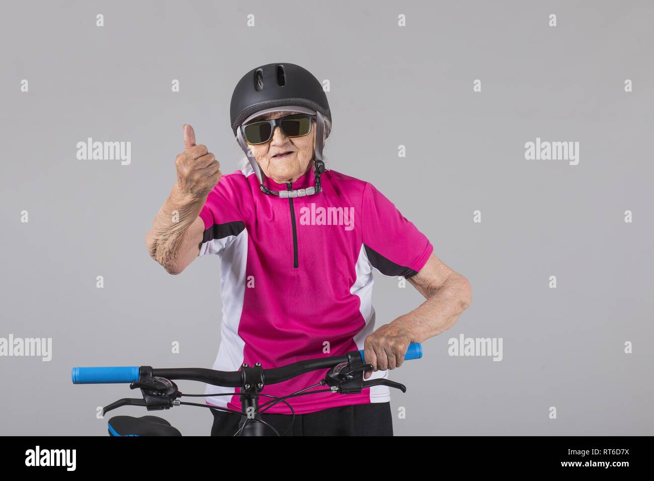 Old biker woman in a helmet Stock Photo - Alamy