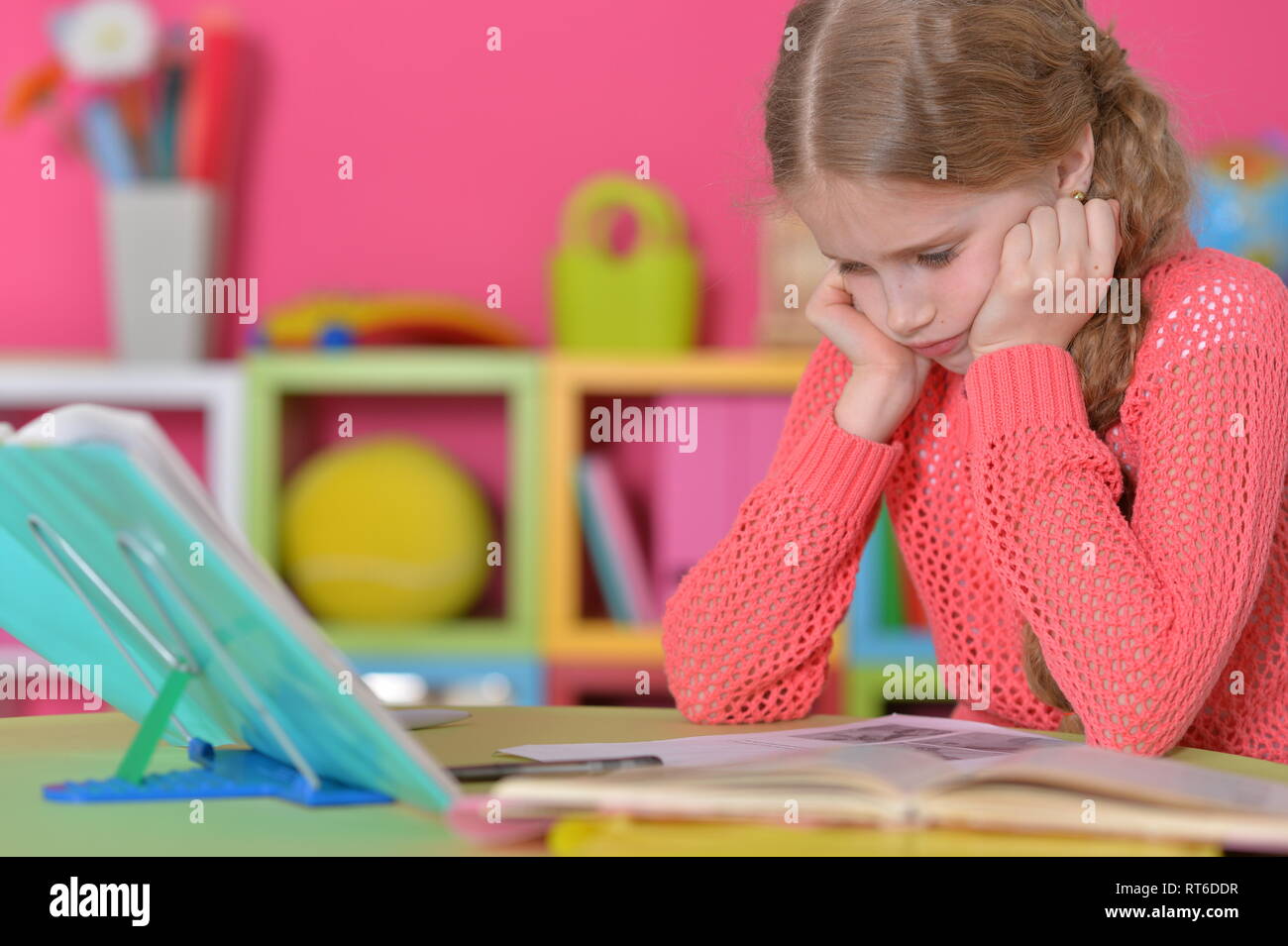 Cute schoolgirl doing homework at her room Stock Photo - Alamy