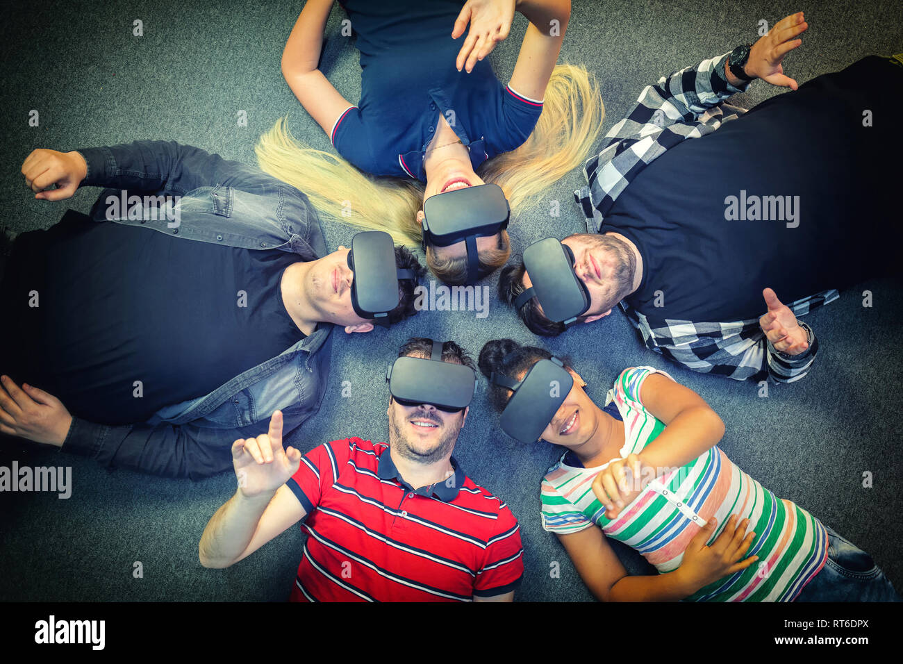 Multiracial group of friends playing Virtual reality games on vr ...