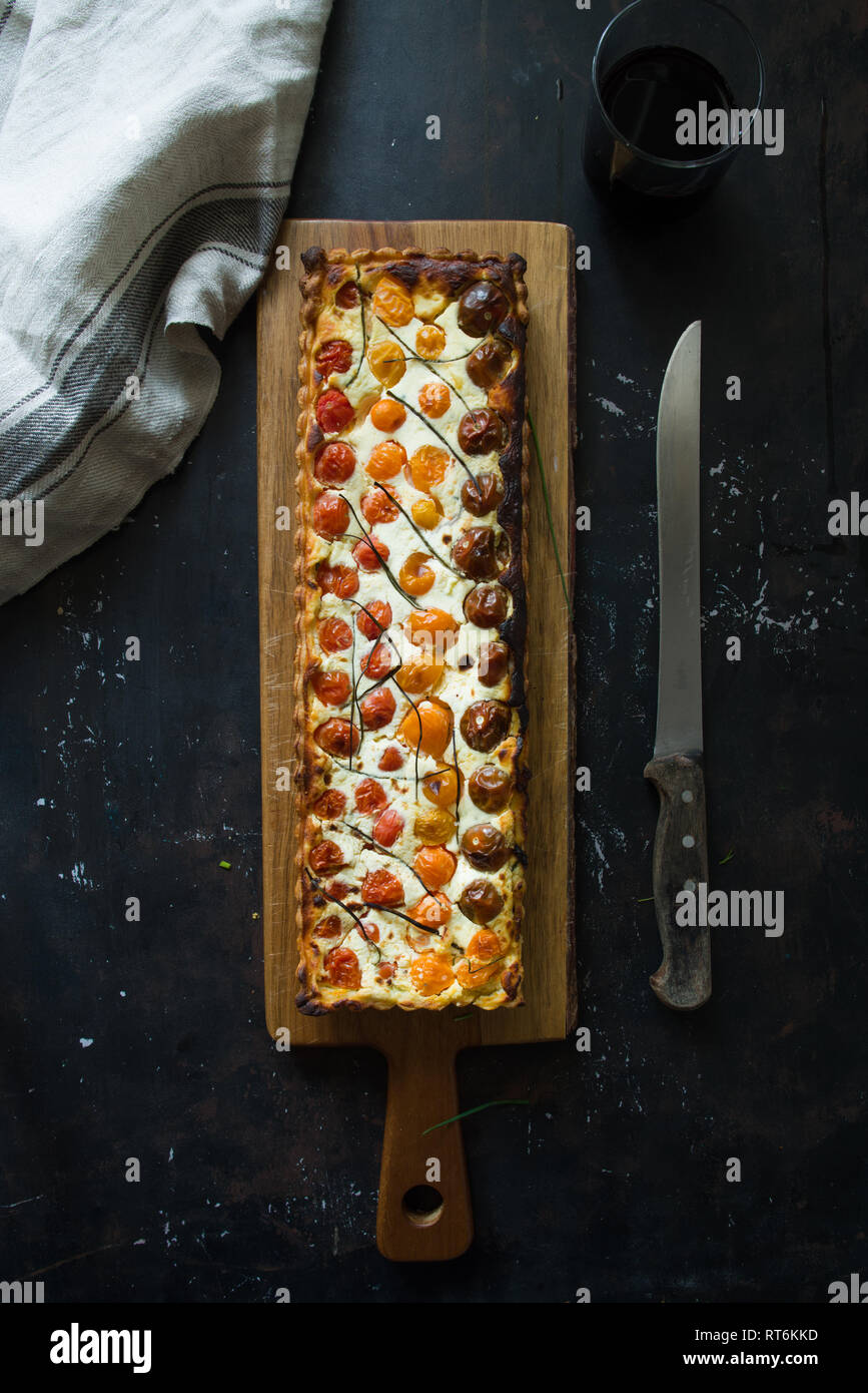 Homemade pie ( quiche) with ricotta, fresh colored tomatoes ...