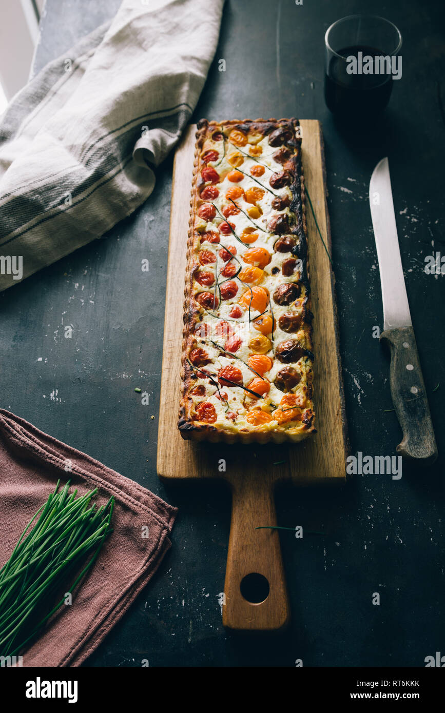 Homemade pie ( quiche) with ricotta, fresh colored tomatoes ...