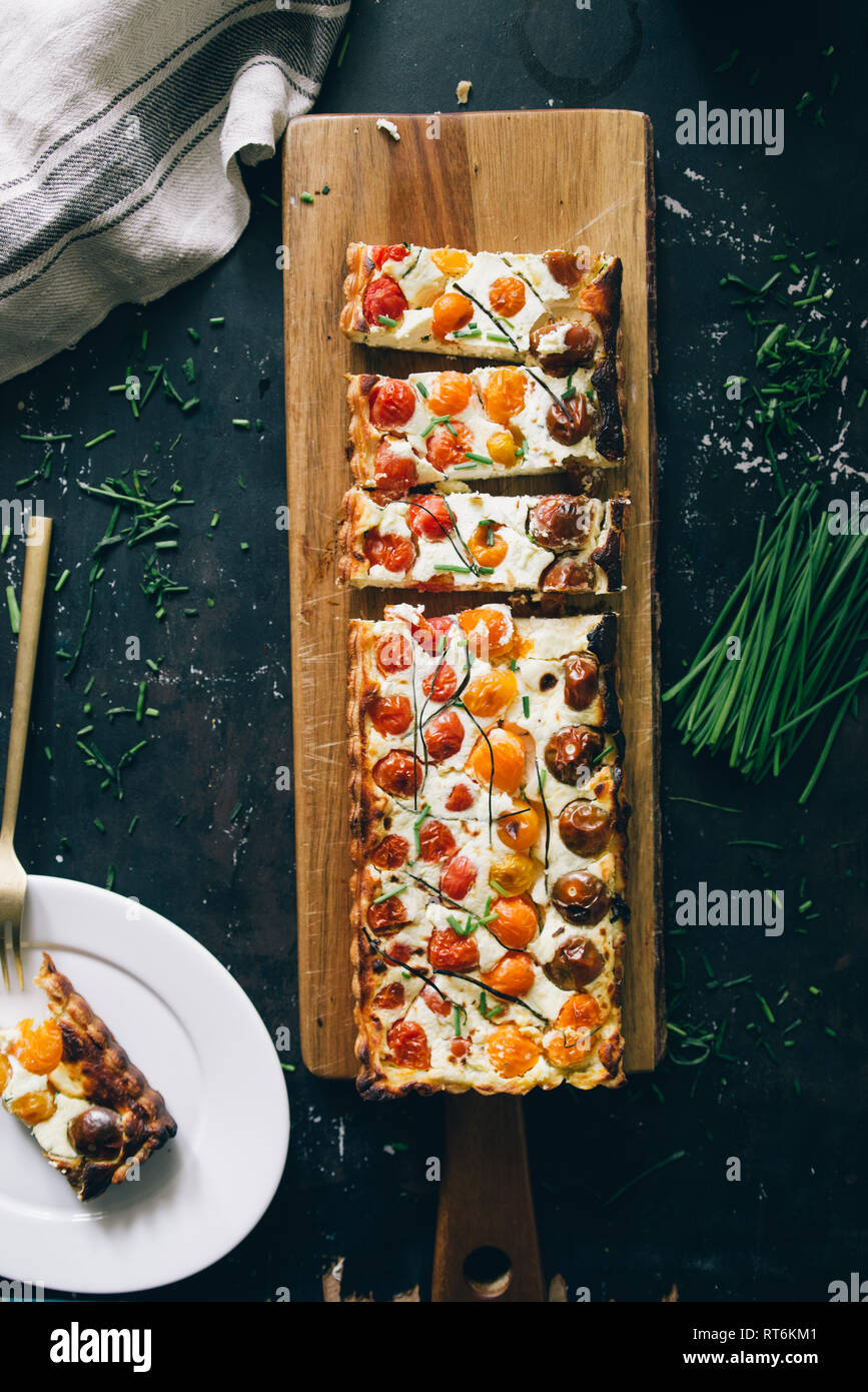 Homemade pie ( quiche) with ricotta, fresh colored tomatoes ...