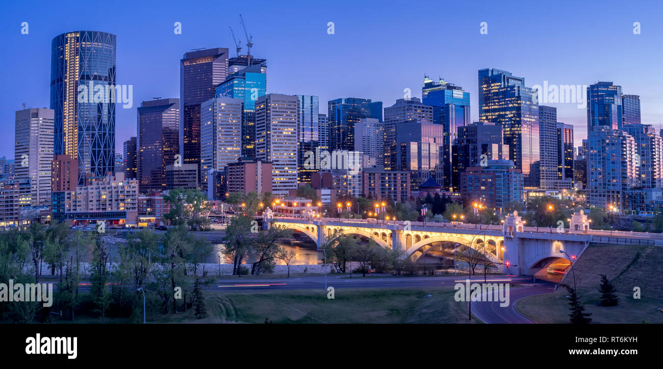 Calgary skyline at night with Bow River and Centre Street Bridge ...
