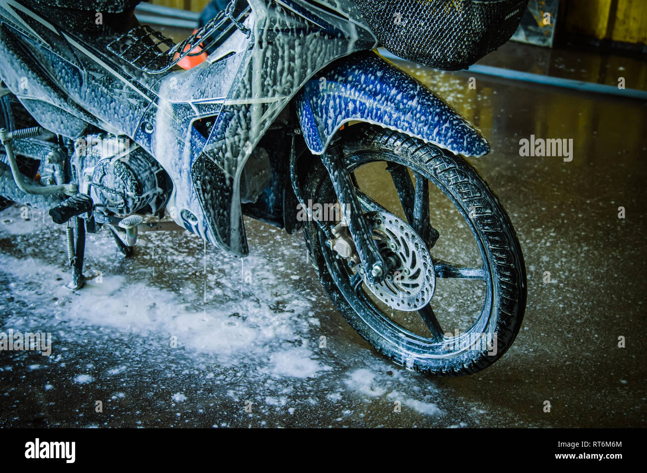 Wash motorcycle with foam Stock Photo - Alamy