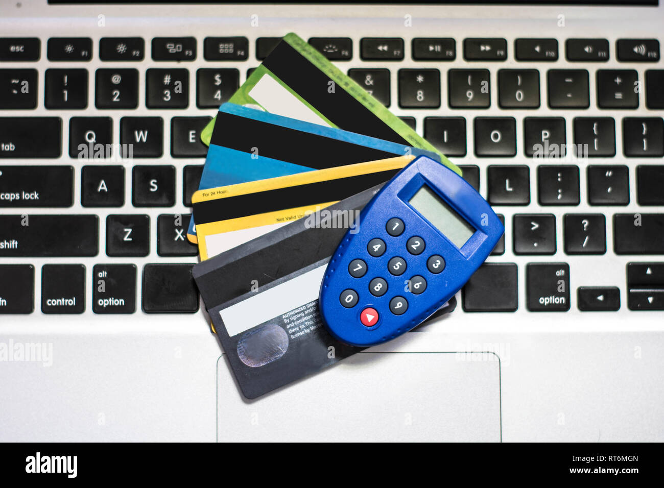 credit card with security token and smartphone with keyboard as ...