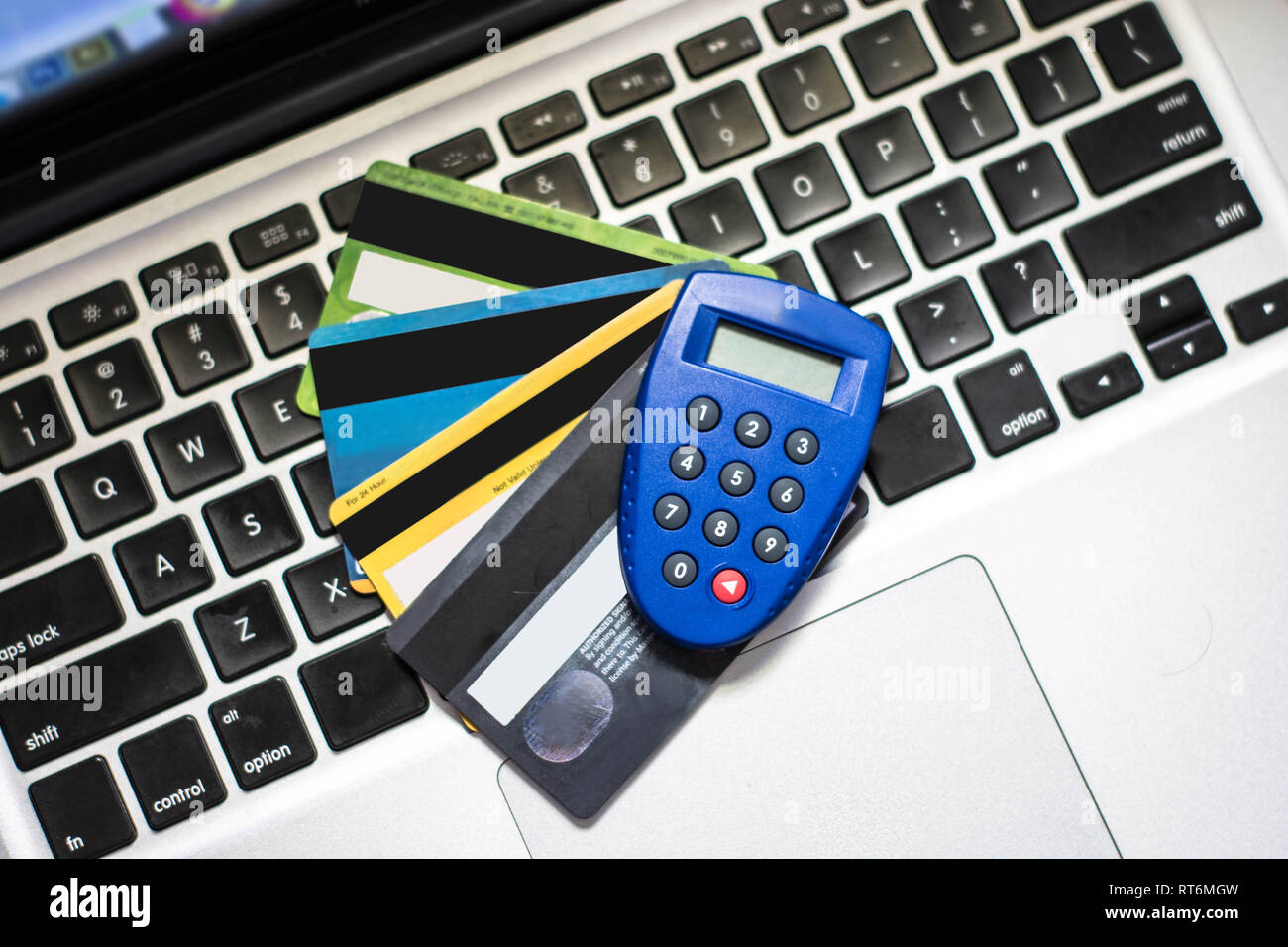 credit card with security token and smartphone with keyboard as ...