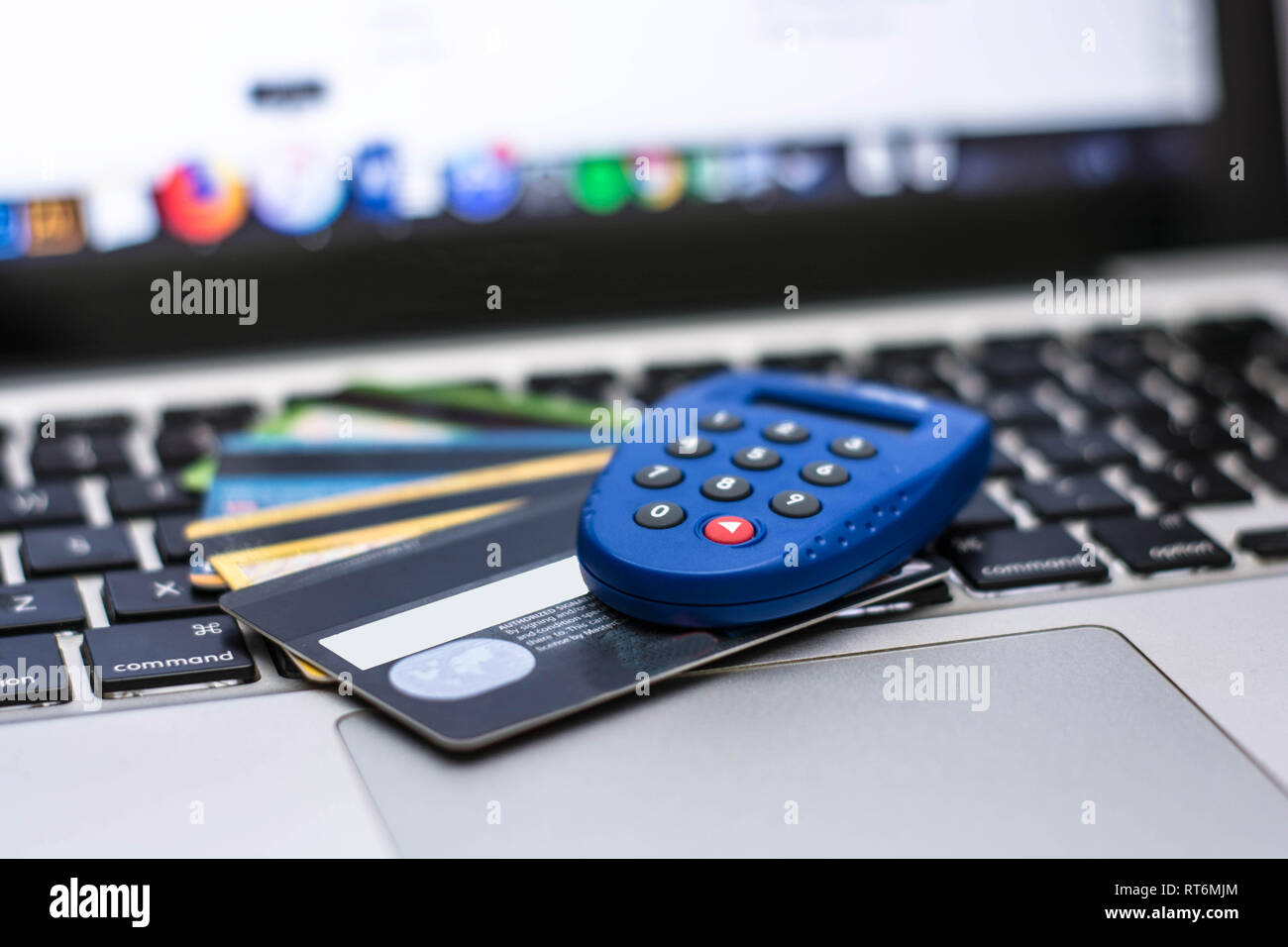 credit card with security token and smartphone with keyboard as ...