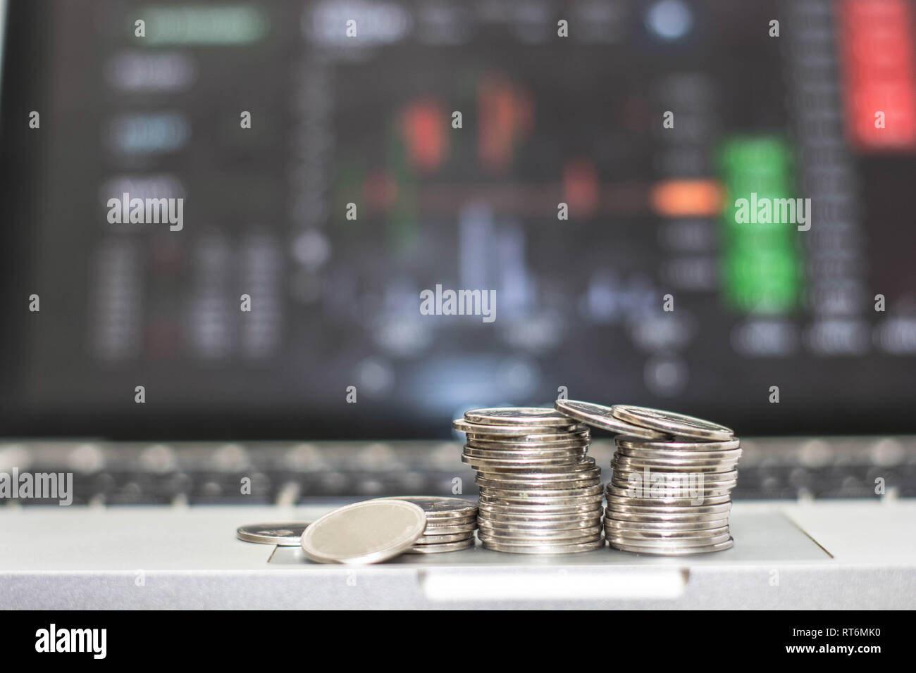 silver coin with monitor shows trading traffic, Bitcoin minning, coin ...