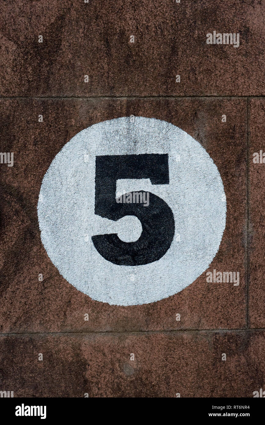 Number Five Door Number Painted In Black Within A White Circle On A ...